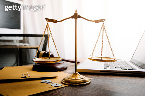 law legal technology concept. judge gavel on computer with scales of ...
