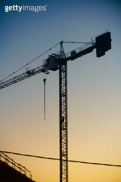 Crane Operator climbing ladder to the top of Construction Tower Crane ...