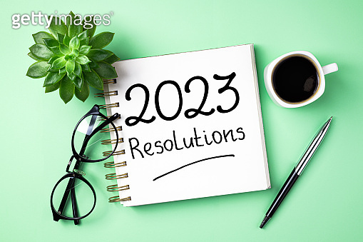New year resolutions 2023 on desk. 2023 resolutions list with notebook ...