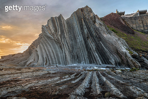 View of the Flysch rock formations and cliffs at sunrise on the Basque ...