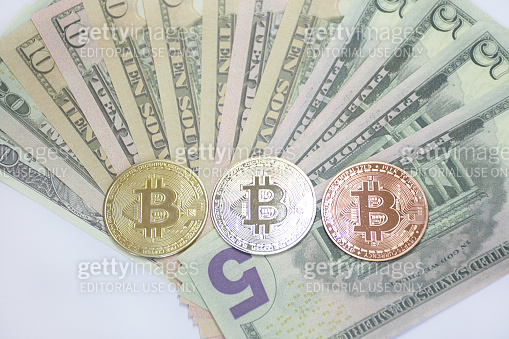 three bitcoin coins in the shape of a triangle on a background of ...