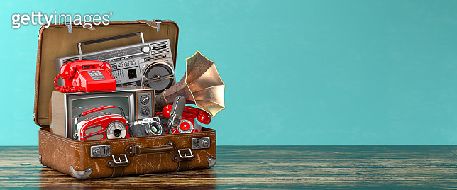 Vintage electrical and electronic appliances in an old suitcase ...