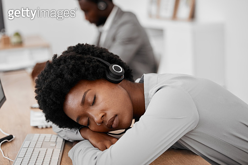 Call center, burnout and sleep of a woman employee resting on a desk at ...