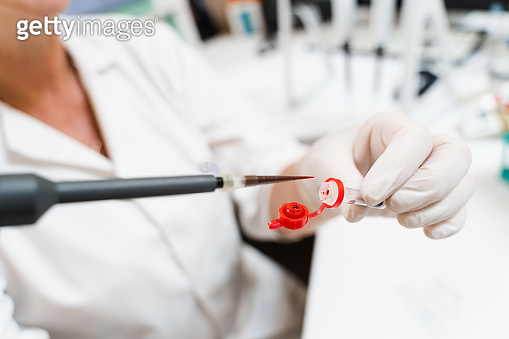 Using microdoser for blood analysis and test in laboratory. Medical ...