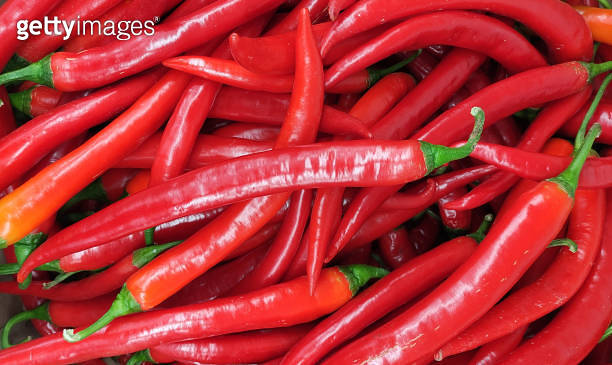Red hot chili peppers close up top view, bitter peppers harvested in a ...