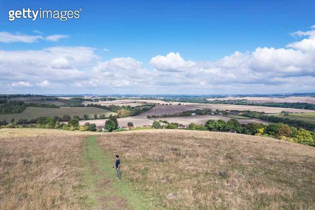 Hiking man walking in the field, Amazing view of Goring and Streatley ...