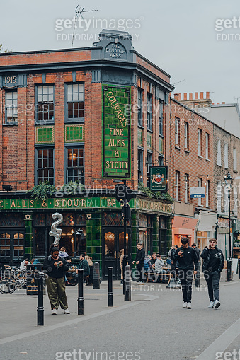 People walk on Exmouth Market in Exmouth Market street in Clerkenwell ...