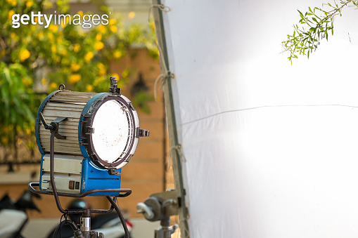 Process of filming. Spotlight illuminates. Movie set with many lamps ...