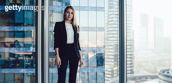 Half length portrait of pretty blonde business woman in trendy elegant ...
