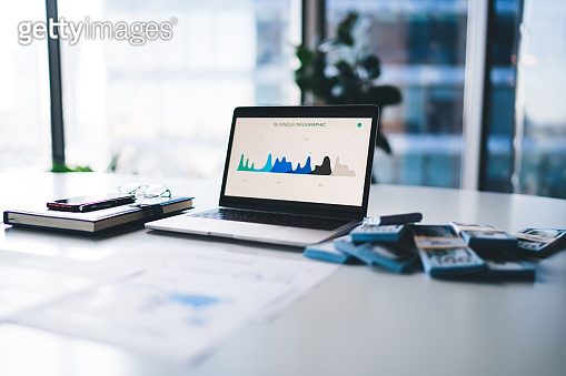 Electronic netbook technology with business infographics on laptop ...