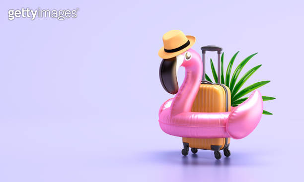 Inflatable pink flamingo, a suitcase on wheels and a palm leaf. Summer ...