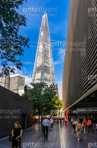 The Shard with people going to work in the foreground London United ...