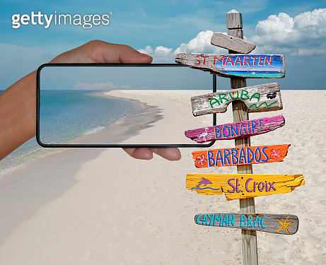 Caribbean beach scene with colorful wood distance sign 이미지 (1411630801 ...