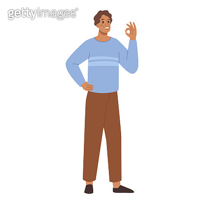 Man standing and pointing by hand ok sign, approved hand gesture ...