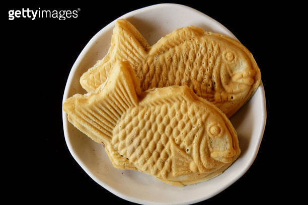 Taiyaki is a fish-shaped waffle filled with red bean paste inside ...