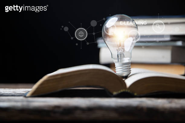 Light bulbs and books. Concept of reading books, knowledge, and searching for new ideas ...