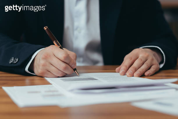 Close-up photo of Asian businessman's hands signing bank documents, man ...