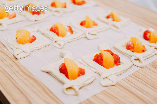 Preparing a dessert at a cooking master class. Baskets with peaches and ...