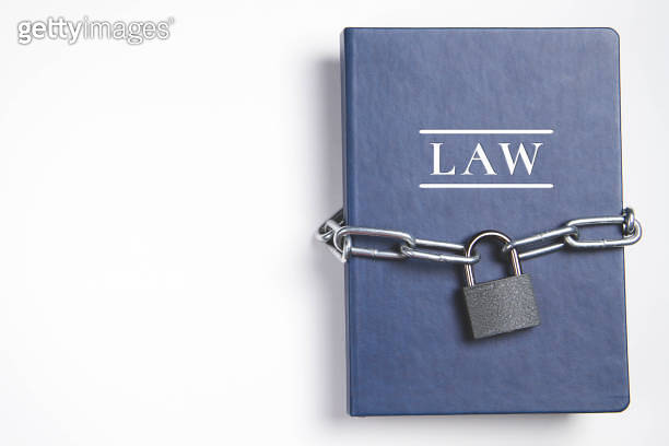 Law. Book with lock. A closed book is banned. The book was wrapped in a ...