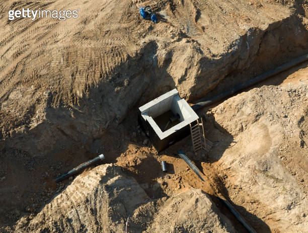 Construction of manhole, stormwater pits, sanitary sewer system ...