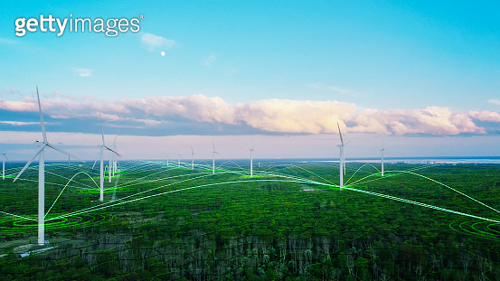 Scenic Aerial Drone Footage of Environmental Wind Turbines in a Forest ...
