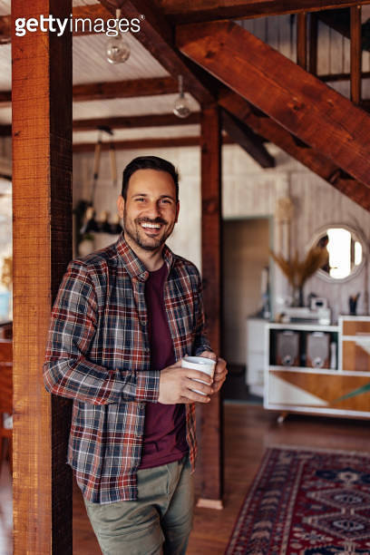 Man smiling at the camera, drinking first-morning coffee. 이미지 ...