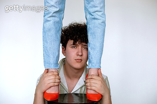 Portrait of curly brown-haired young handsome man looking throw woman ...