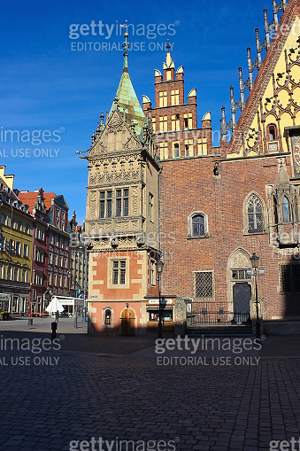 old town hall building with a clock in the center on Wroclaw Square ...