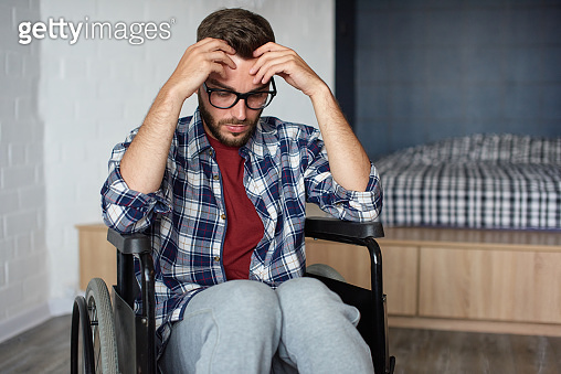 Depressed and tired disabled young man in wheelchair 이미지 (1420419661 ...