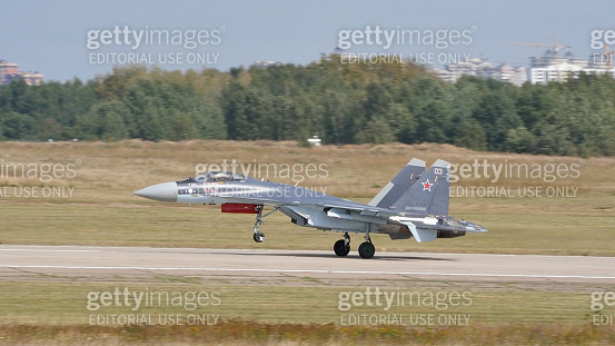Russia combat aircraft in dark grey camouflage on the runway ...