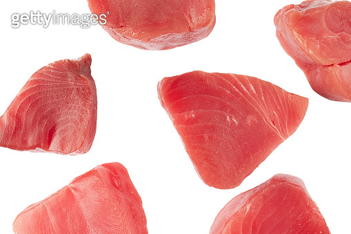 Yellow fin tuna steaks isolated on black background. Fresh rare tuna ...