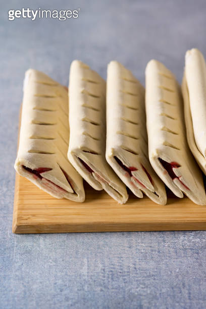 Homemade Uncooked Puff Pastry Buns on Wooden Board Blue Background ...