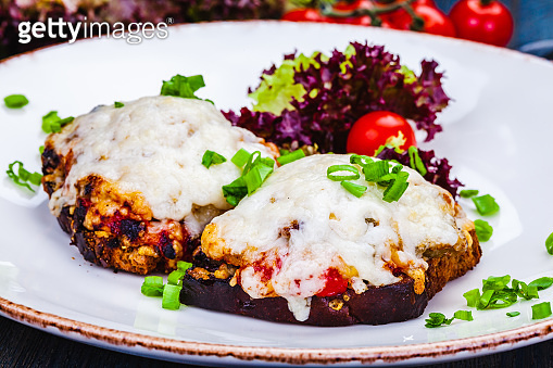 Healthy toasts with grilled rye bread with tomato, melted cheese on ...