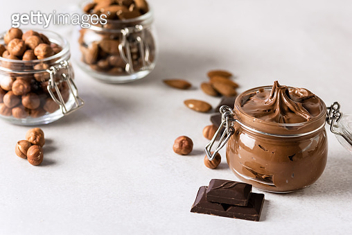Hazelnut and Almond Spread with Nuts and Chocolate Bar Glass Jars with ...