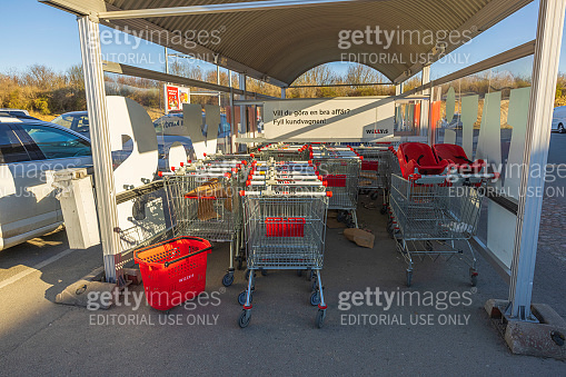 Close up view of outdoor parking place for shopping carts. Close up ...