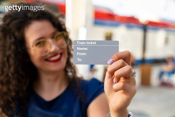 Fashionable girl holding empty train ticket to add text and smiling ...