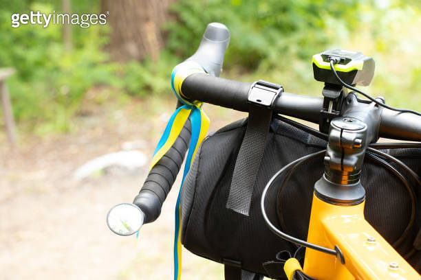 Flag of Ukraine tied to the steering wheel of a sports bike on the ...