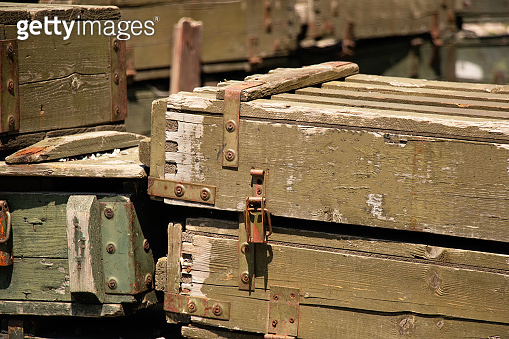 Old green wooden weapon boxes stand outside in the sun,arms (1432768295 ...