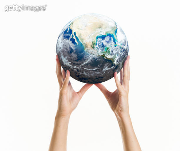 Caring female hands support the Earth: woman cares about the ...