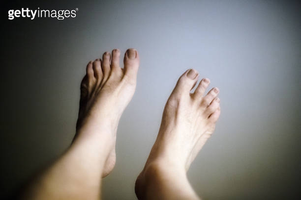 Disembodied human bare feet looking spooky, dreamlike and mysterious ...