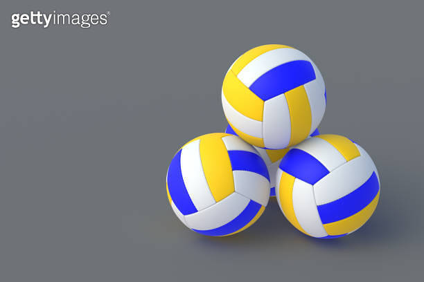Stack of volleyball balls on gray background. Sports equipment ...