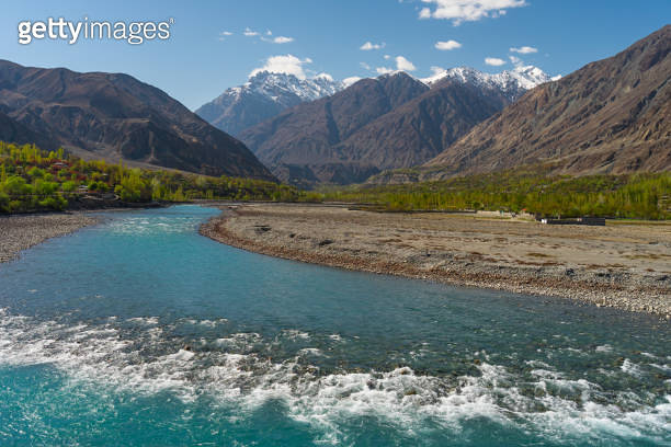 Beautiful Ghizer river, blue river surrounded by Hindu Gush mountains ...