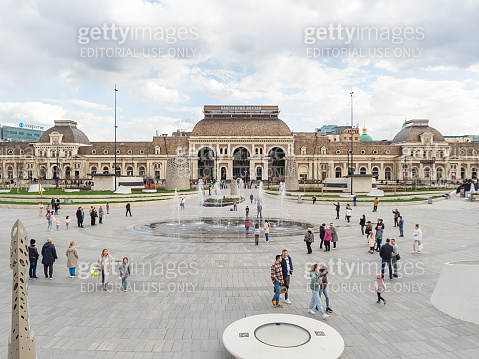 Tourists and local people walk on renovated Paveletskaya square near ...