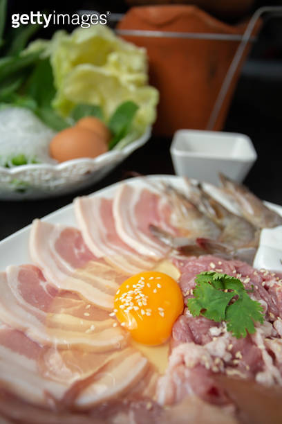 Sliced raw pork, fresh chicken eggs and fresh vegetables, Isaan Thai ...