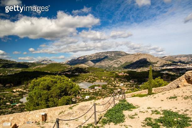 Beautiful view of Polop city in Spain with lush nature and mountains in ...