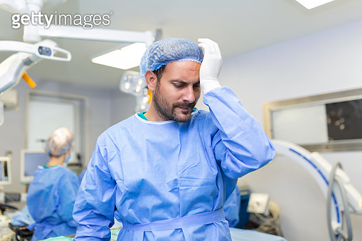 Failure! Sad Surgeon crying. He is feeling sad and tired after ...