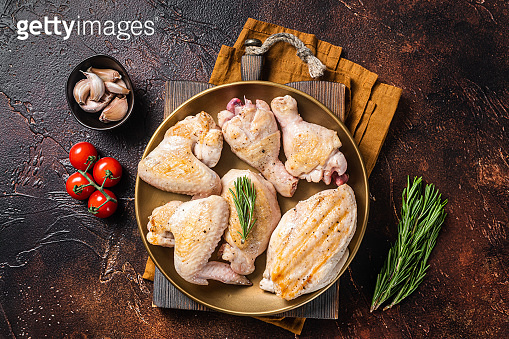 Assortment of Roast chicken meat parts on a plate. Drumstick, breast ...
