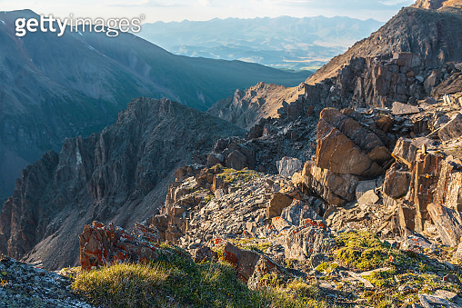 Vastness sunny mountain view from cliff at very high altitude. Scenic ...