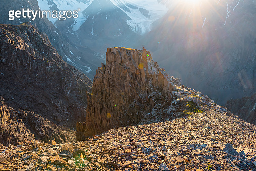 Sunny mountain view from cliff at very high altitude. Scenic alpine ...