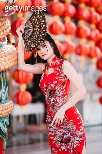Portrait beautiful smiles Asian young woman wearing red traditional ...
